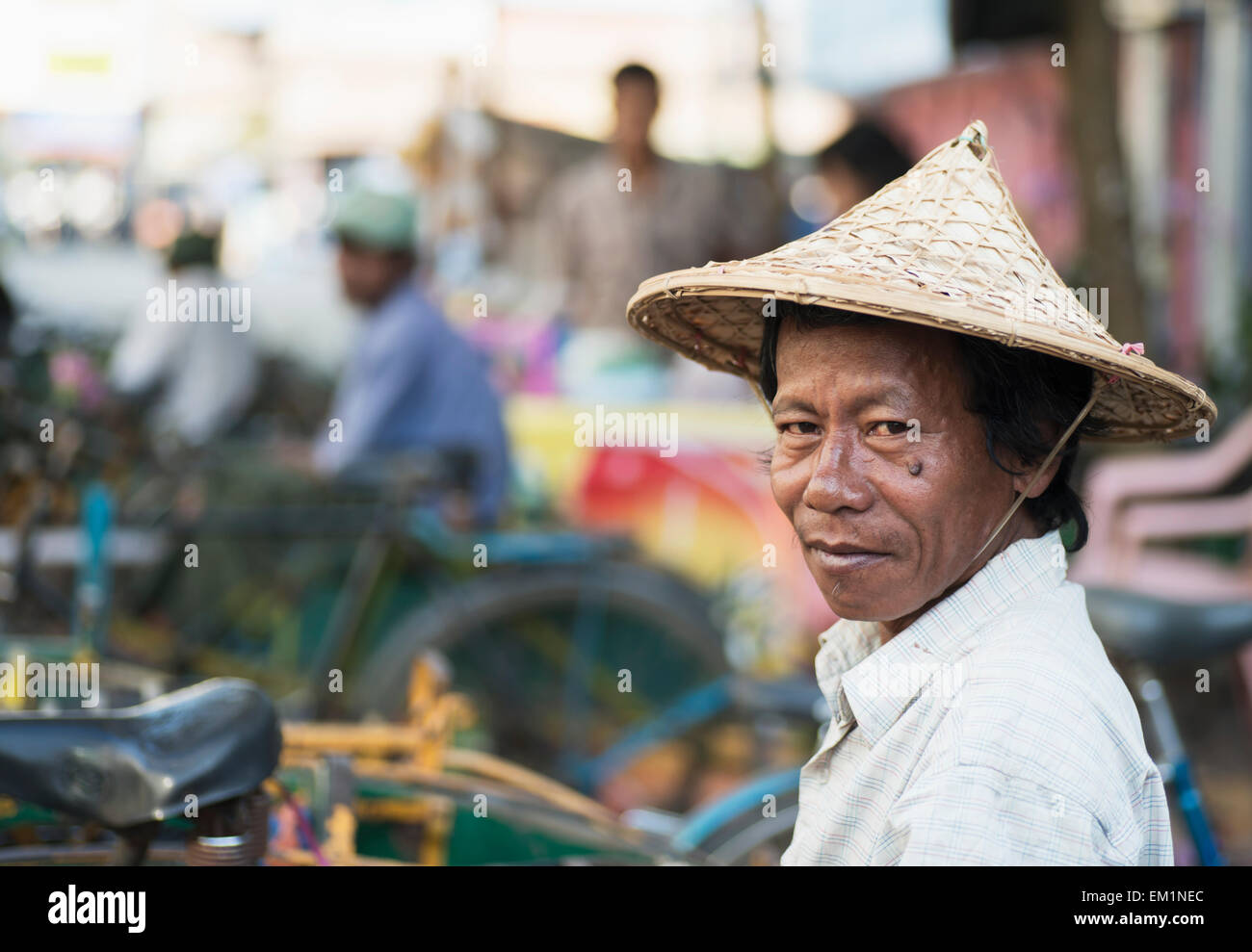 Portrait of a man wearing a conical hat; Sittwe, Rakhine State, Burma ...