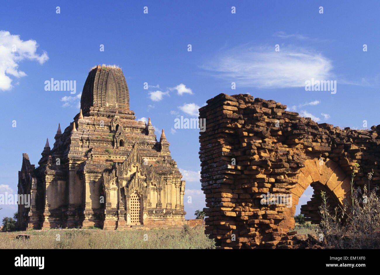 Burma (Myanmar), Old Tayokpye temple and wall in foreground; Bagan ...