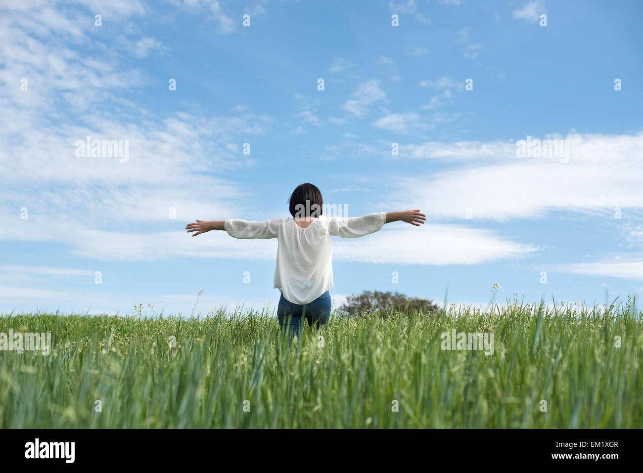 Girl standing with arms open hi-res stock photography and images - Alamy