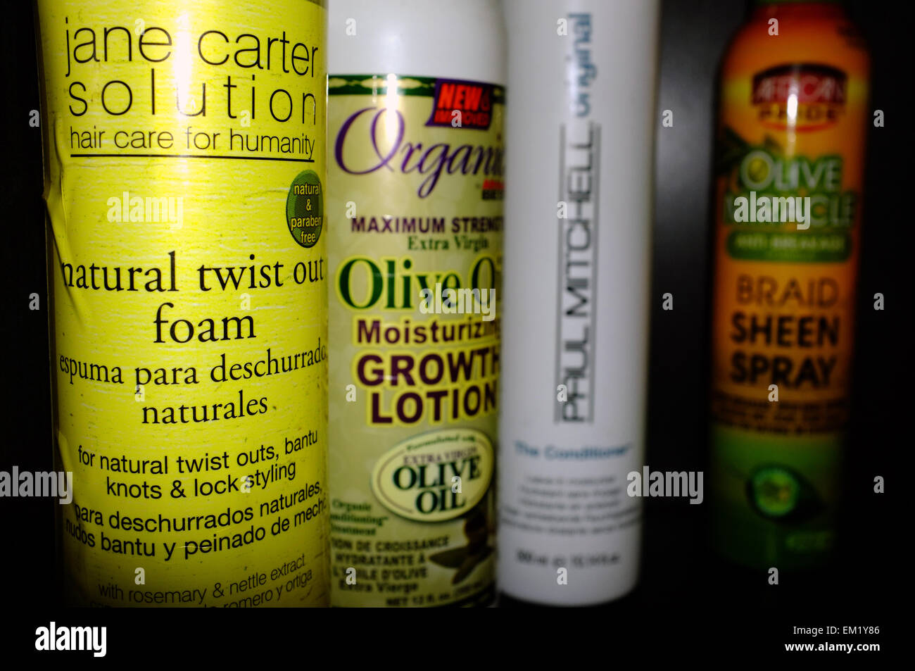 Black hair natural products photographed against a black background ...