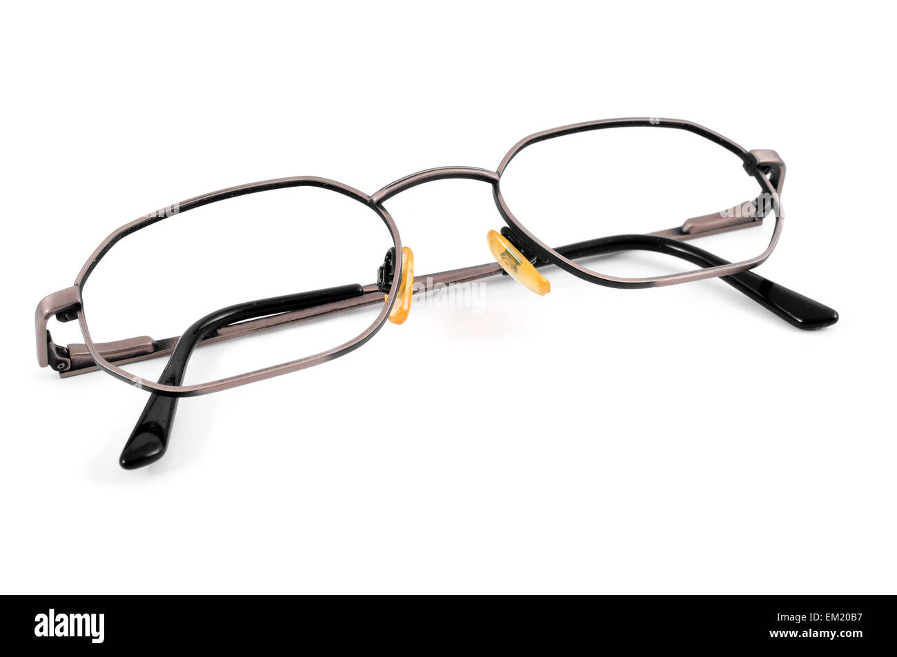 closeup of a pair of metal-rimmed eyeglasses on a white background ...