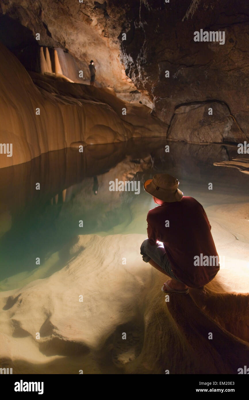 A Filipino Tour Guide Holds A Lantern Inside Sumaging Cave Or Big Cave ...
