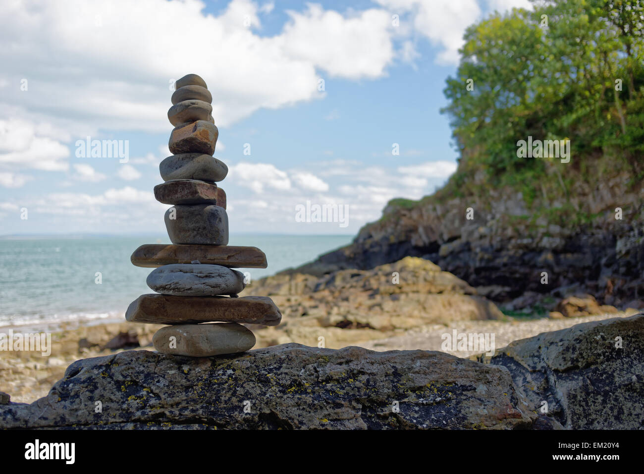 Stones piled artistically on a beach (color version Stock Photo - Alamy