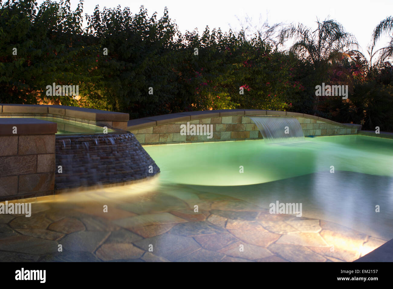 Night Lights Of A Pool With Waterfalls At Dusk; Palm Springs California ...