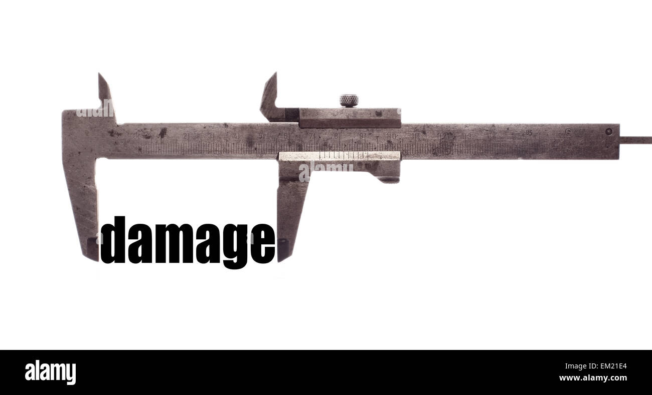 Color horizontal shot of a caliper and measuring the word "damage Stock ...