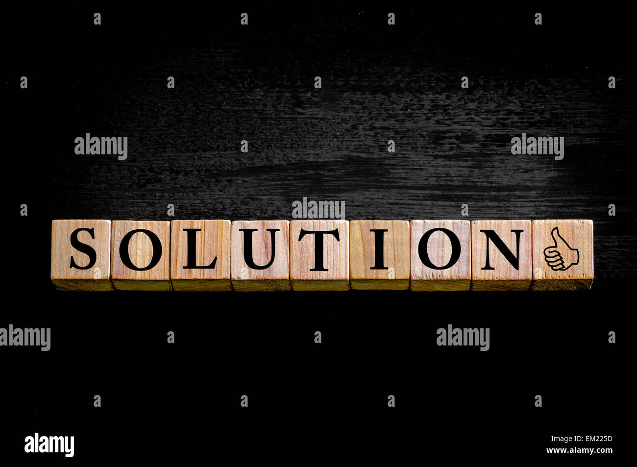Word SOLUTION. Wooden small cubes with letters isolated on black ...