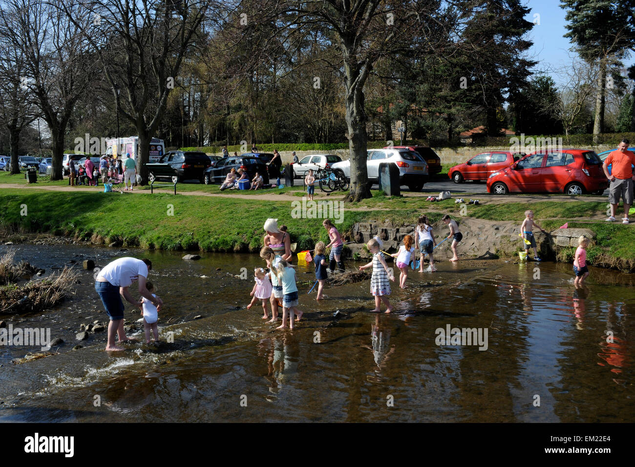 Families paddling and fishing in The River Leven in Great Ayton, North ...