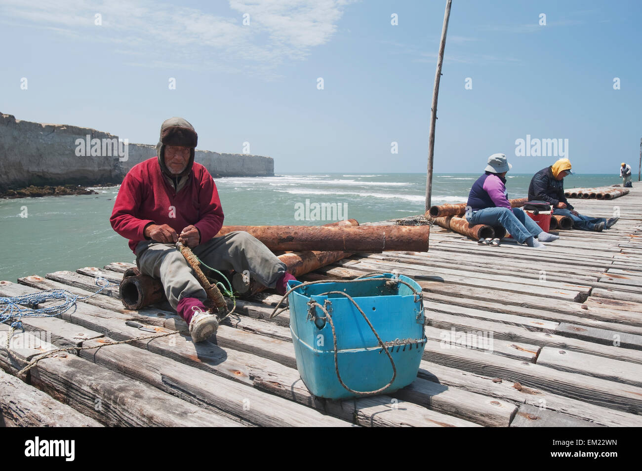 Men working on the pier; Eten, Peru Stock Photo - Alamy