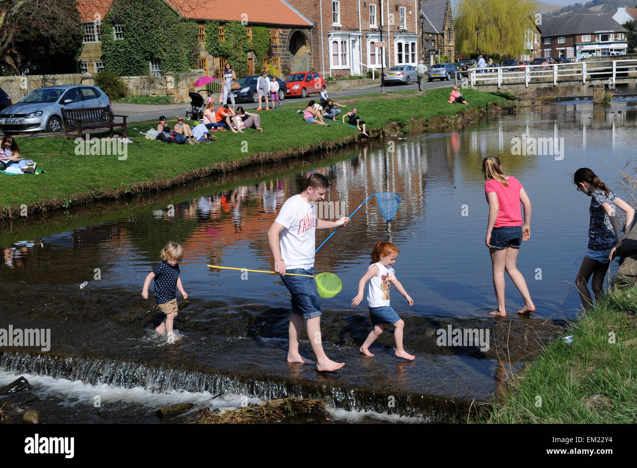 Families paddling and fishing in The River Leven in Great Ayton, North ...