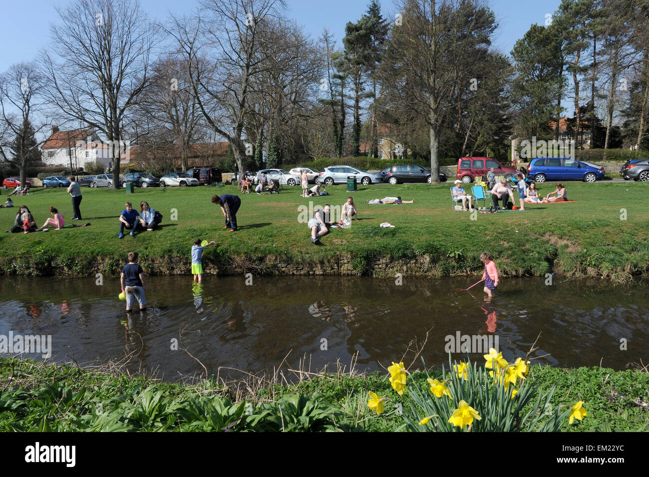 Families paddling and fishing in The River Leven in Great Ayton, North ...