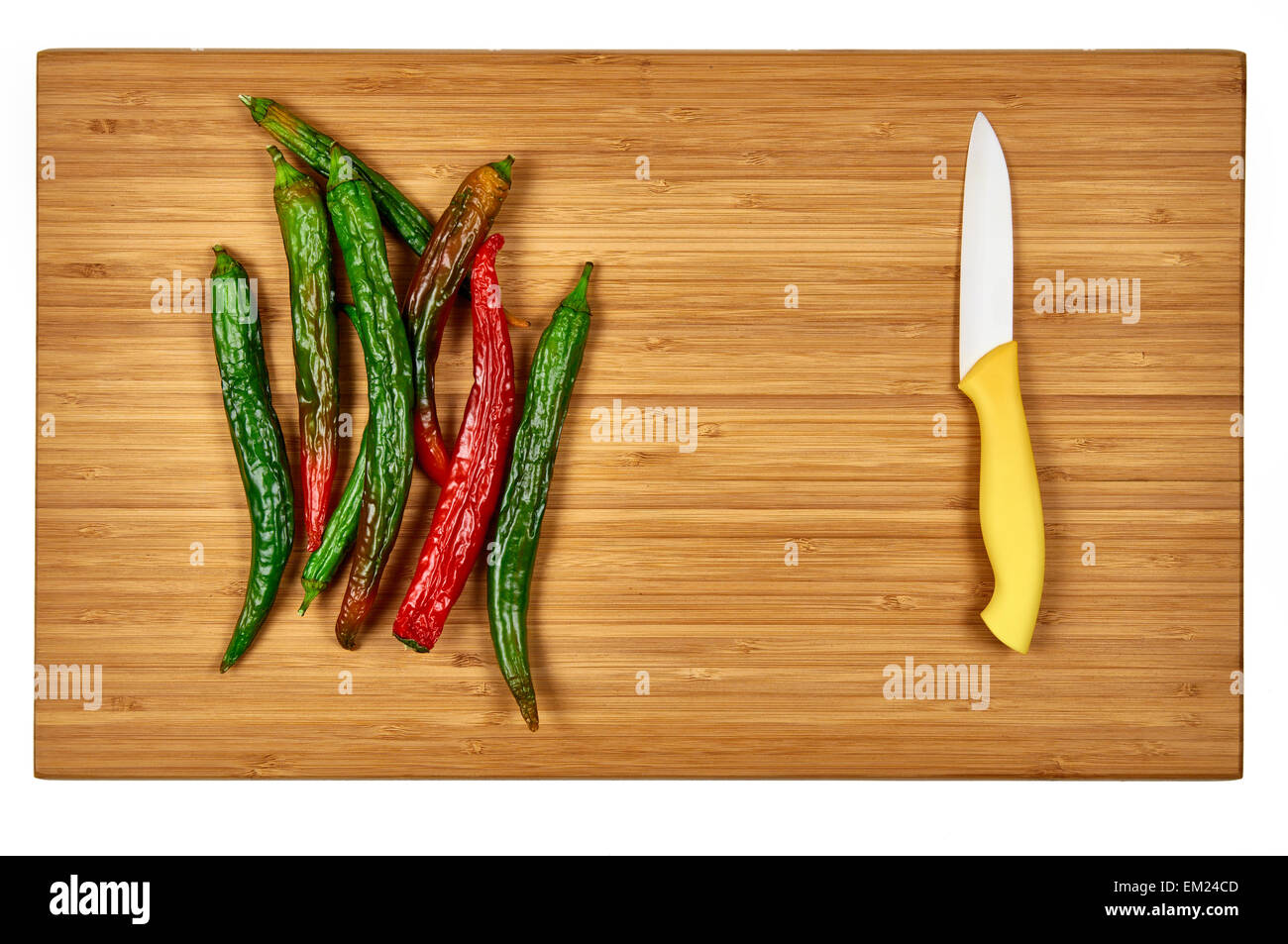 Hot pepper on wooden cutting board Stock Photo - Alamy