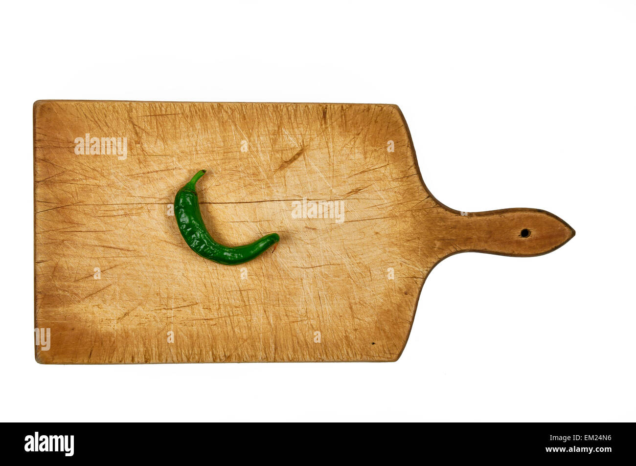 Hot pepper on old fashioned wooden cutting board Stock Photo - Alamy