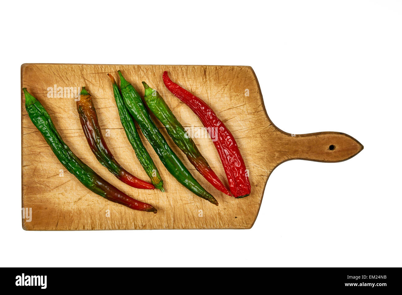 Hot pepper on old fashioned wooden cutting board Stock Photo - Alamy