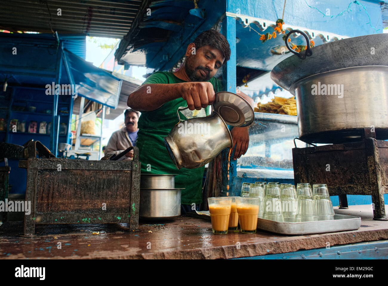 Preparing chai on a stand at Udaipur's old town Stock Photo - Alamy