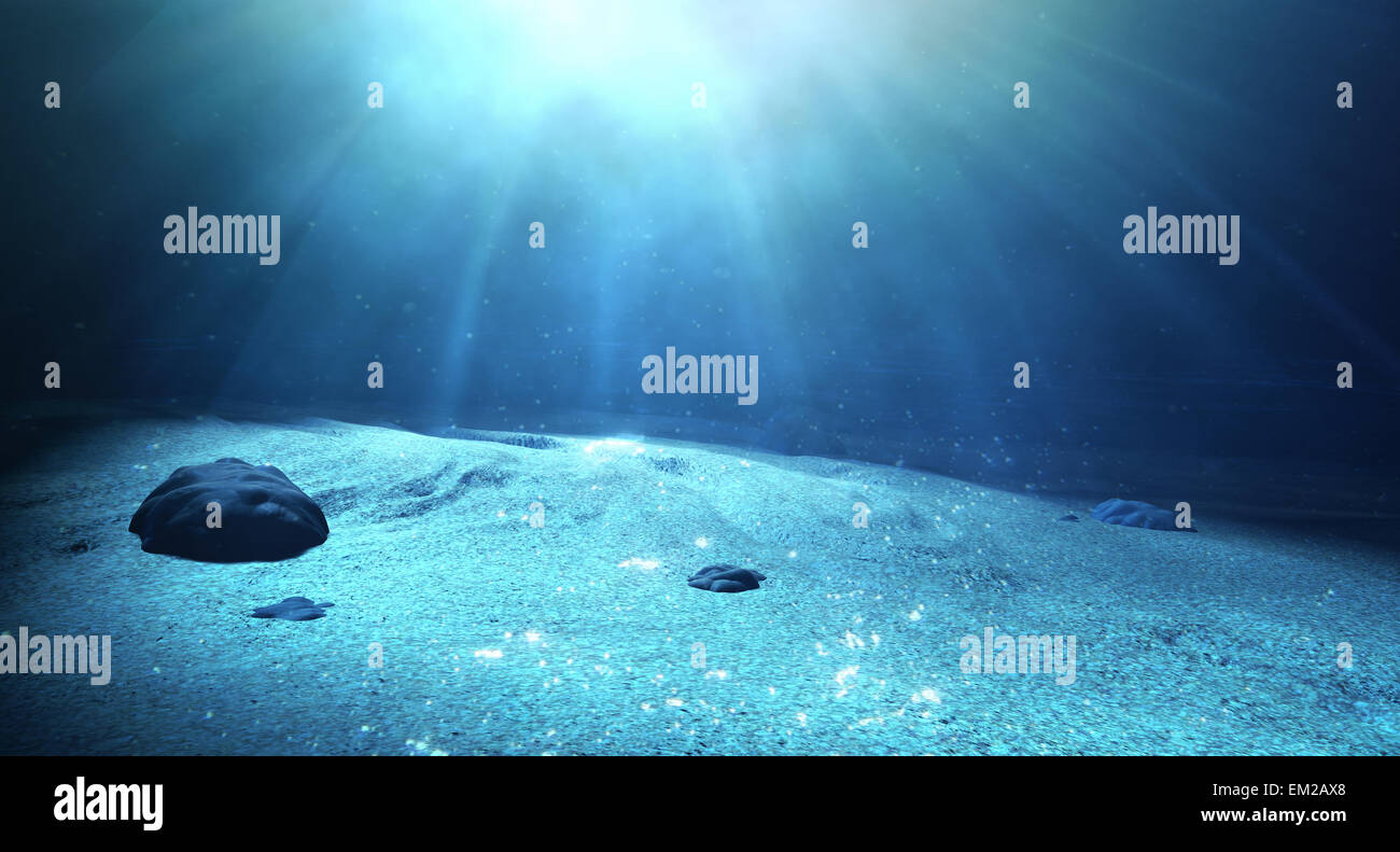 An underwater scene at the bottom of the ocean floor showing sand and ...