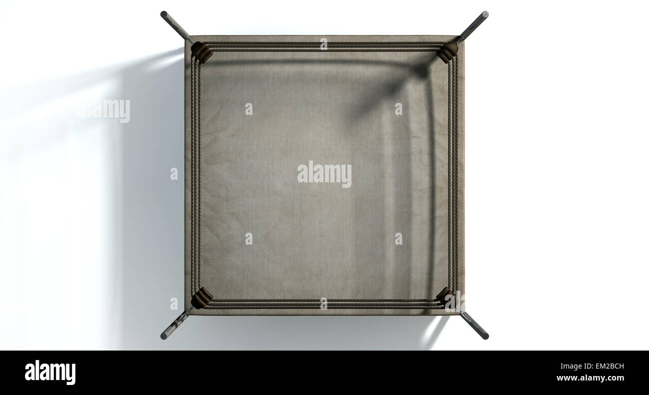An old vintage boxing ring surrounded by ropes on an isolated white ...