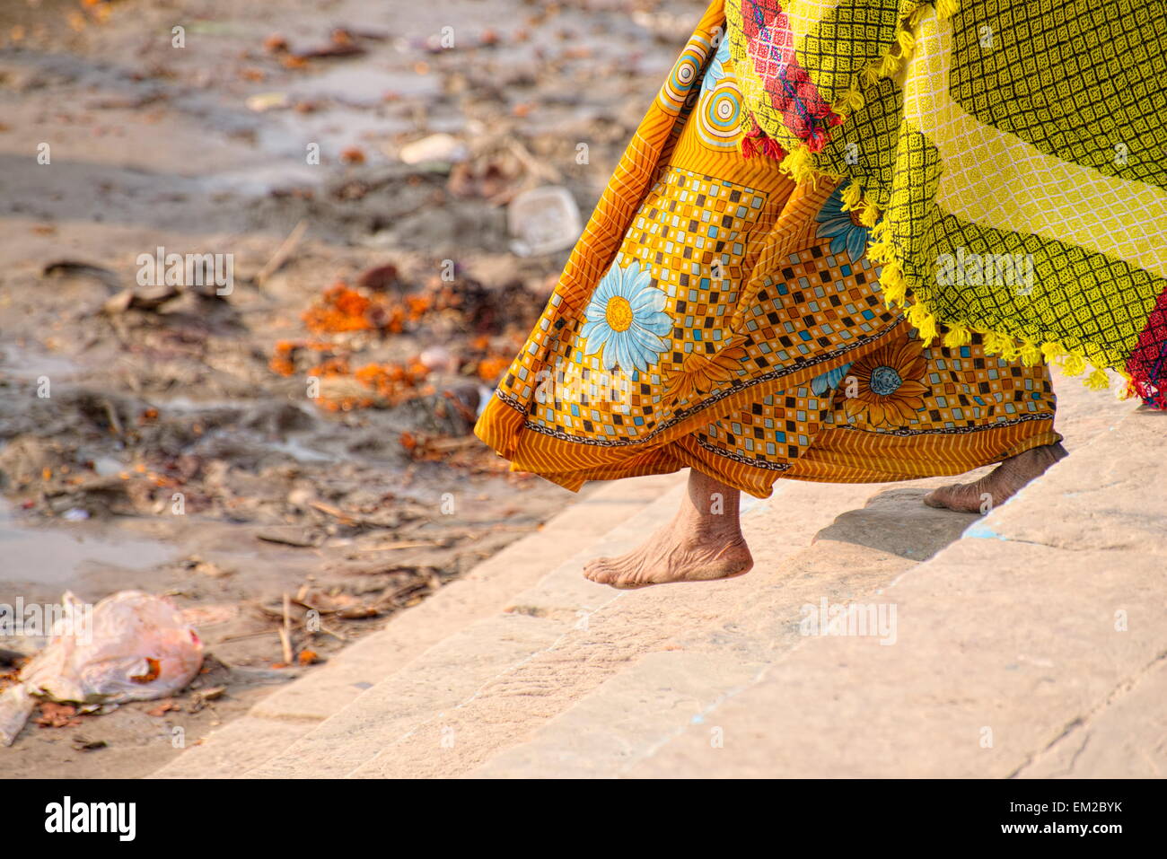 Woman walking Ganges for ceremonial bathing Stock Photo - Alamy