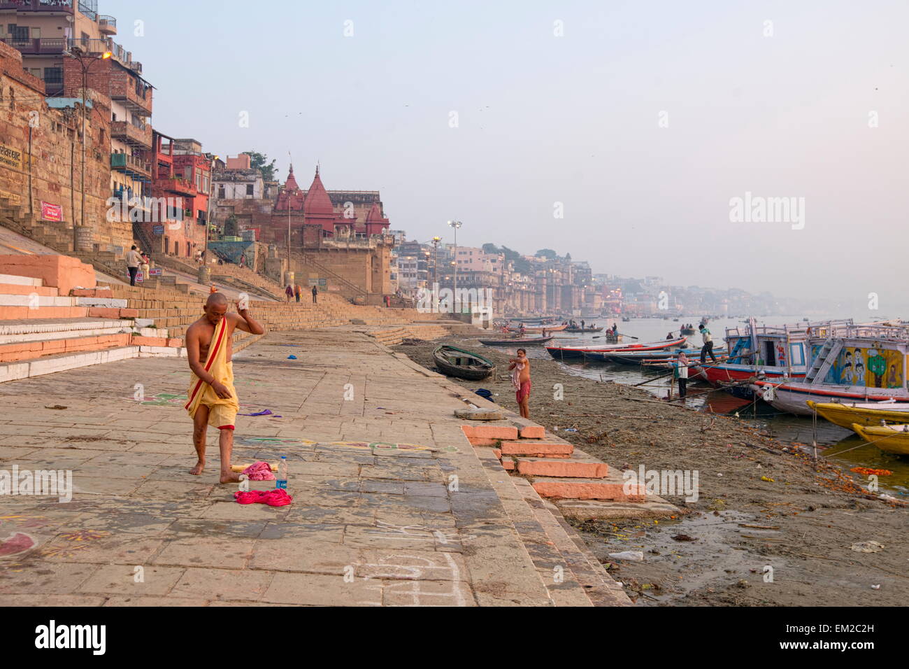 Bathers in the Ganges early in the morning at one of the ghats of ...