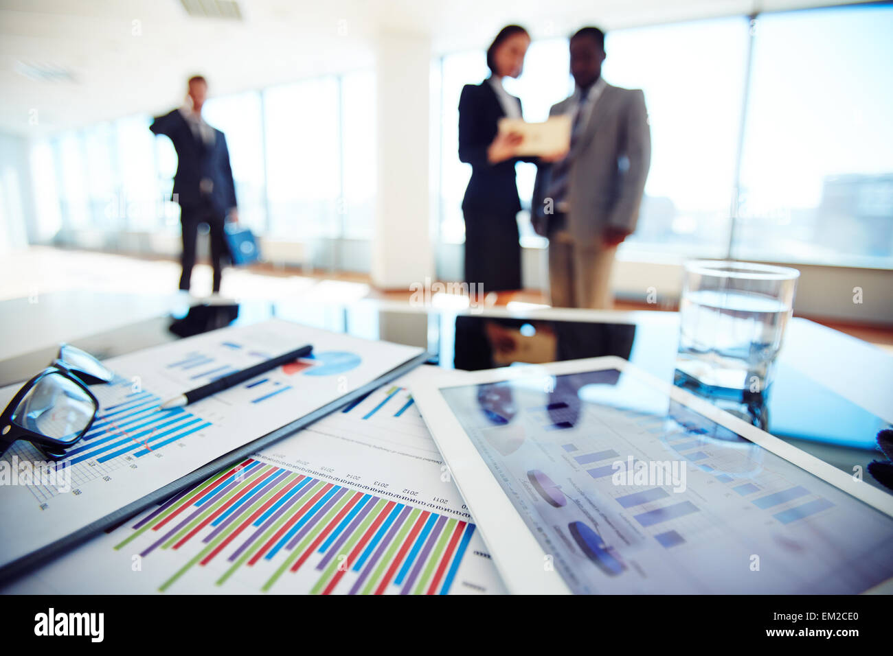 Paper and electronic business documents on desk Stock Photo - Alamy