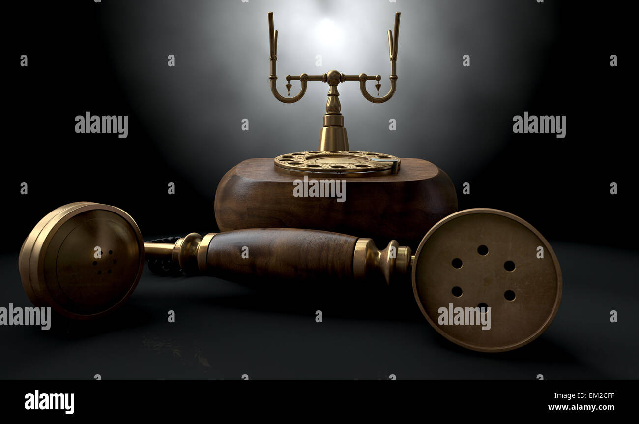 A vintage wood and brass telephone with dial embellishments and the ...