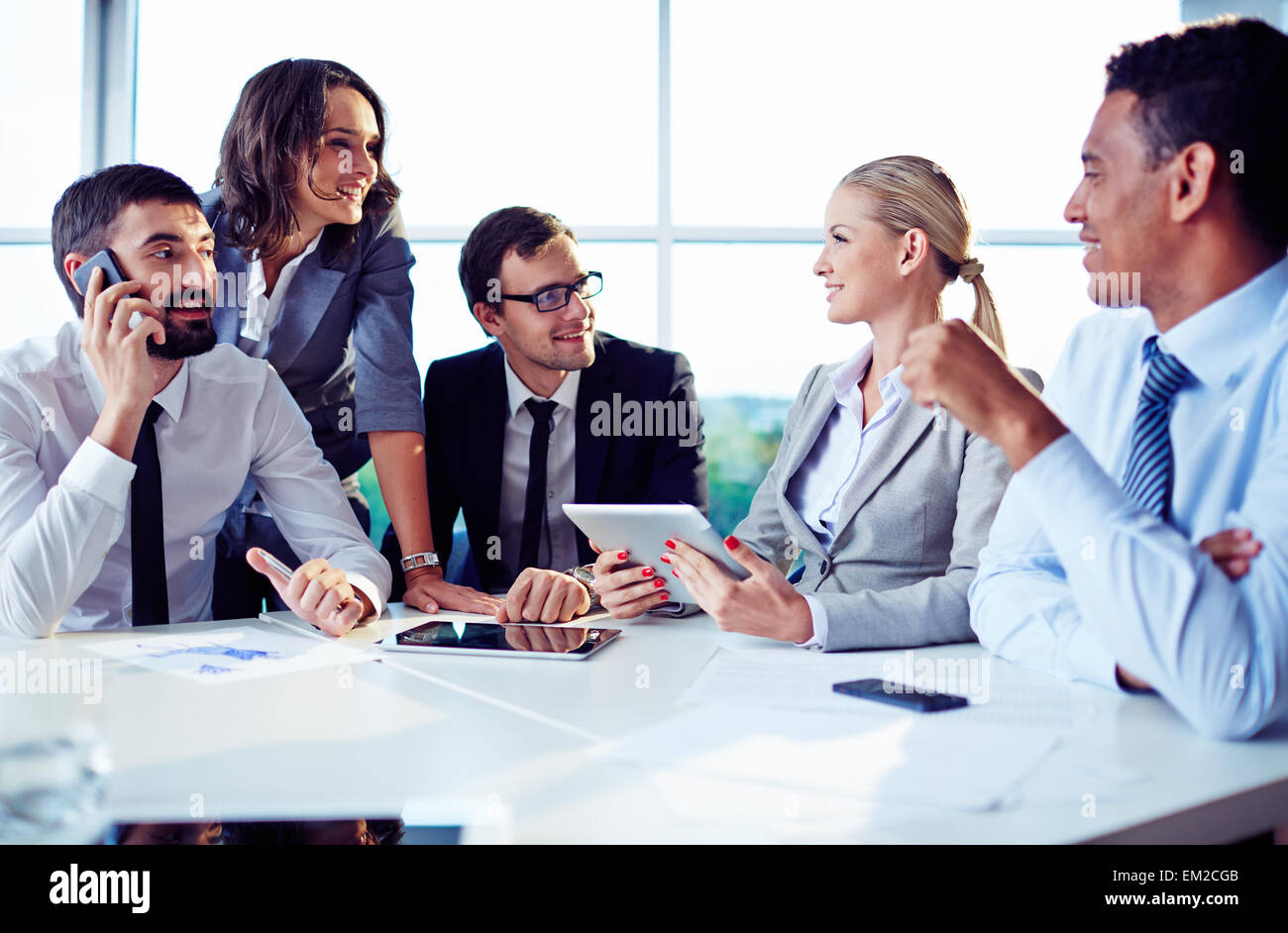 Team office workers discussing ideas hi-res stock photography and ...