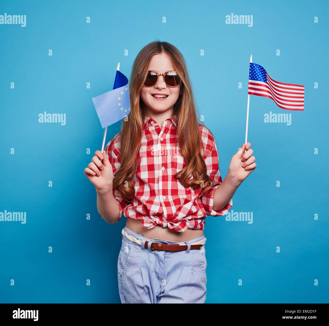 Happy girl with USA and EU flags Stock Photo - Alamy