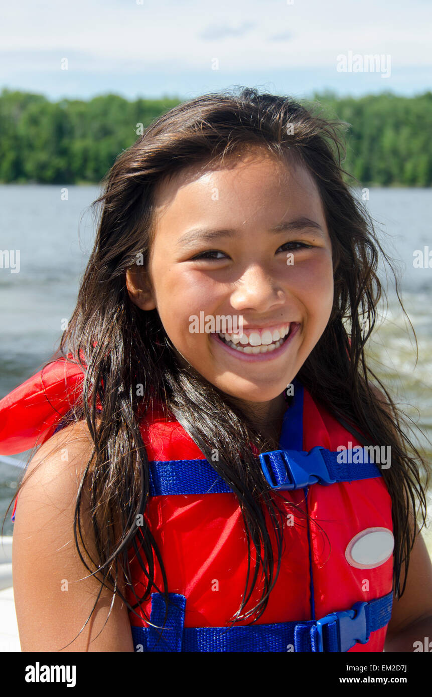 A Girl Wearing A Lifejacket; Lake Of The Woods Ontario Canada Stock ...