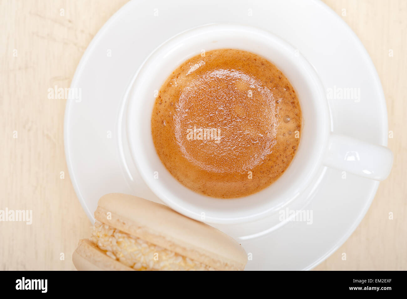 colorful macaroons with espresso coffee over white wood table Stock ...