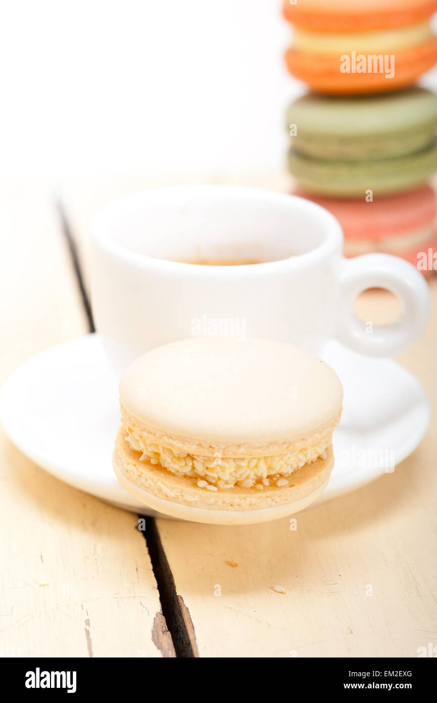 colorful macaroons with espresso coffee over white wood table Stock ...
