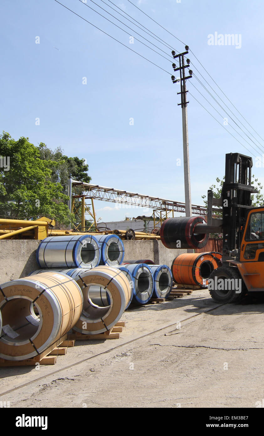 view of the storage of steel coils with a loader for loading and ...