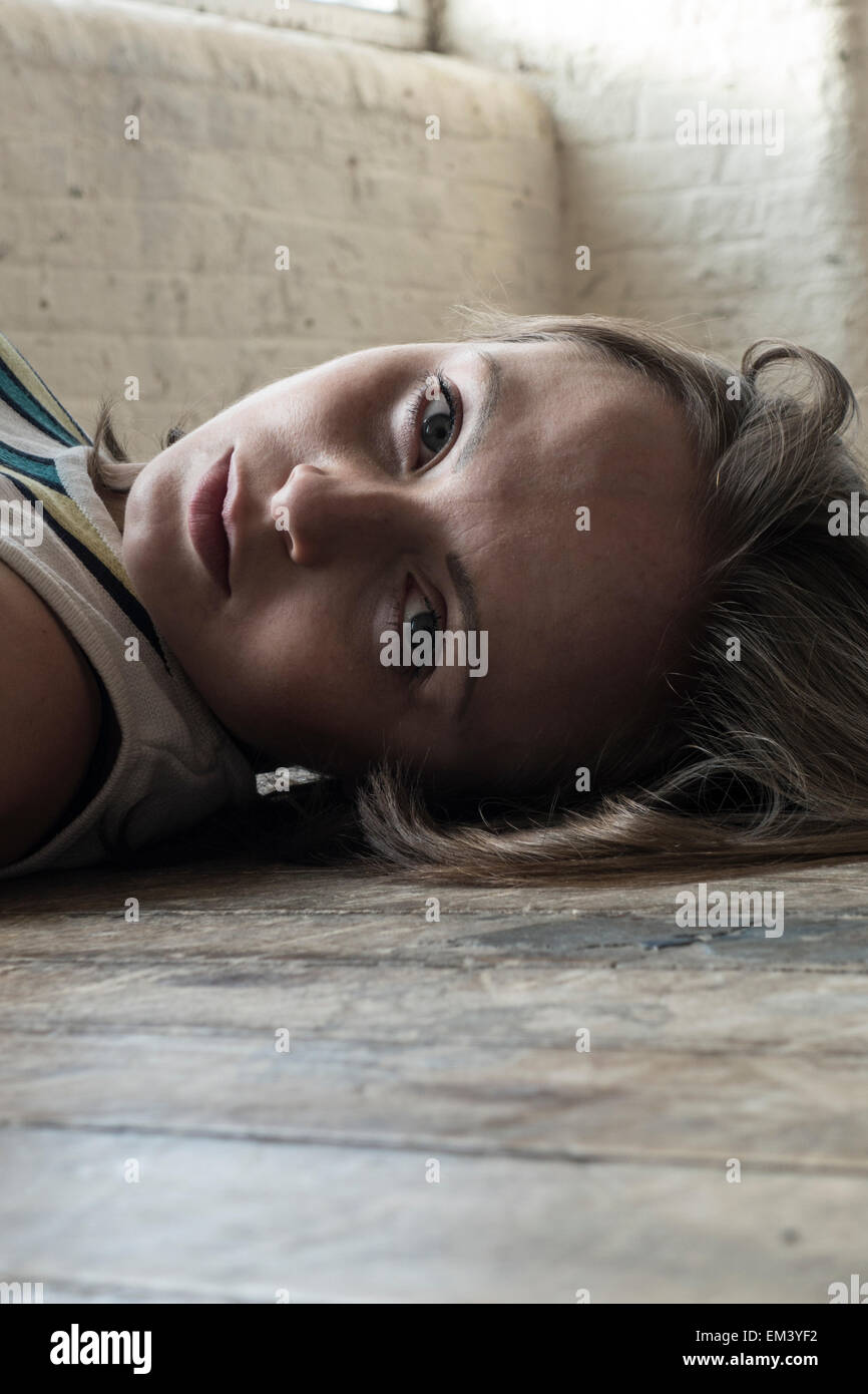 Beautiful woman lying on floor hi-res stock photography and images - Alamy