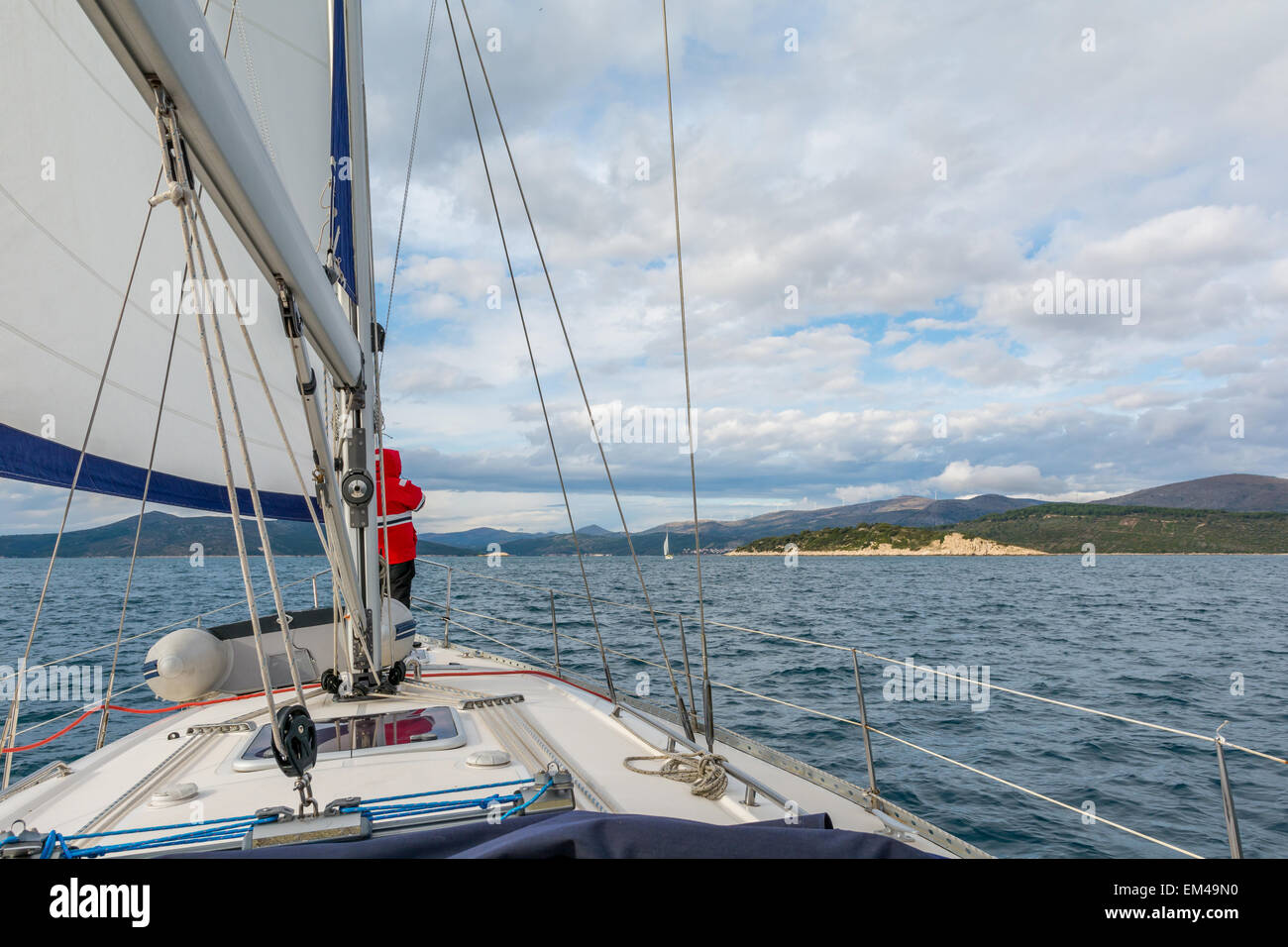 Sailor on a Bow of Sailing Yacht Stock Photo - Alamy
