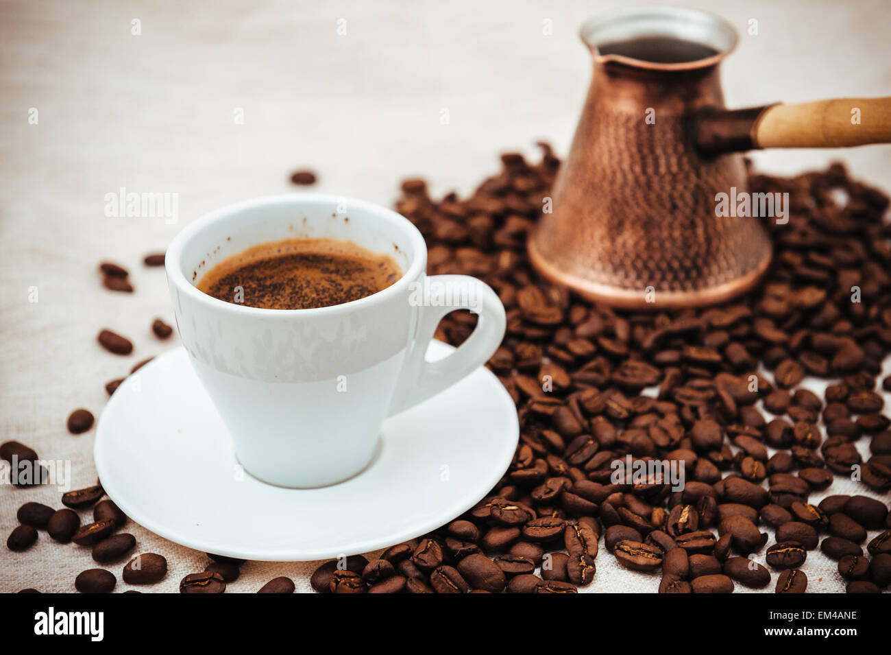 Coffee turk and cup of coffee on burlap background. coffee beans ...
