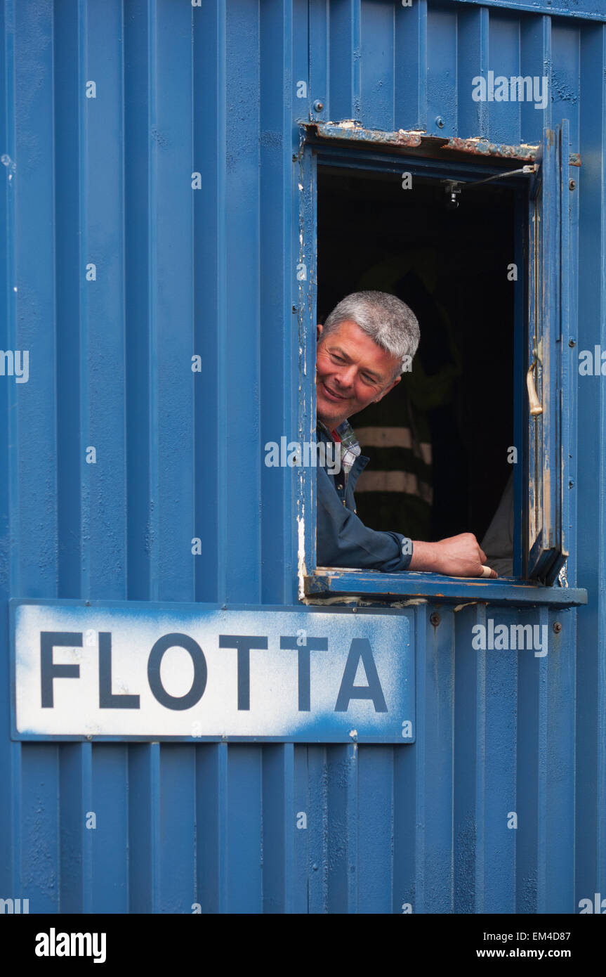 Harbourmaster on the island of Flotta jetty in the Orkney Islands ...