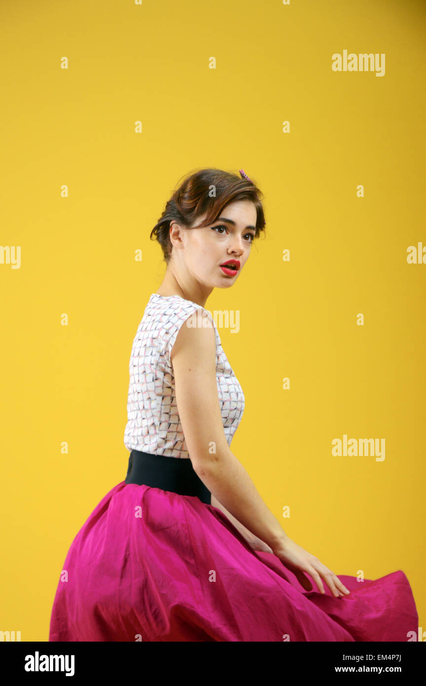 Photo Expo-2015. Moscow girl model posing on a yellow background Stock ...