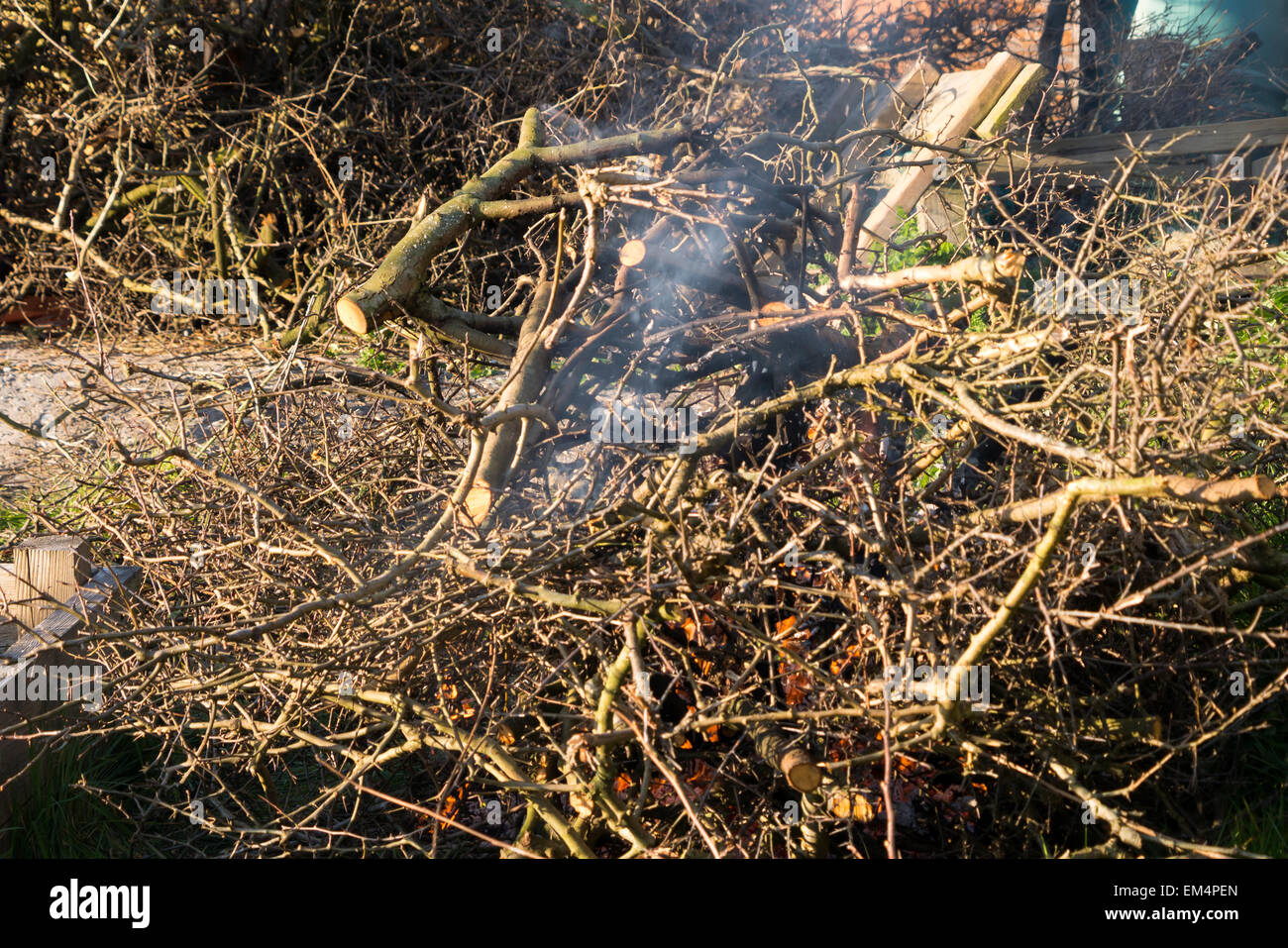 Lighting a Bonfire Burning Rubbish in Garden Stock Photo - Alamy