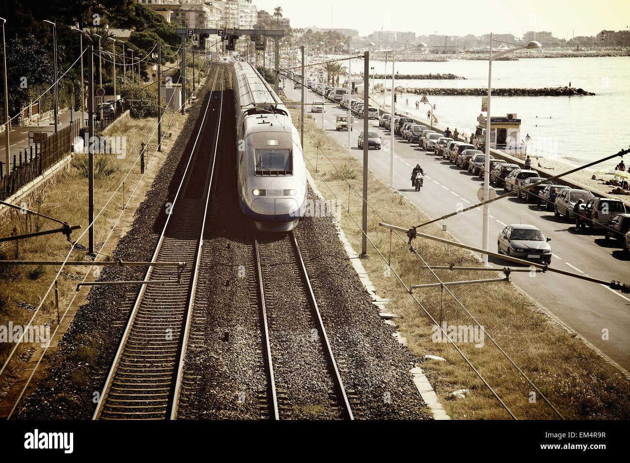 Train And Traffic On The Road Along The Waterfront; Cannes Provence ...