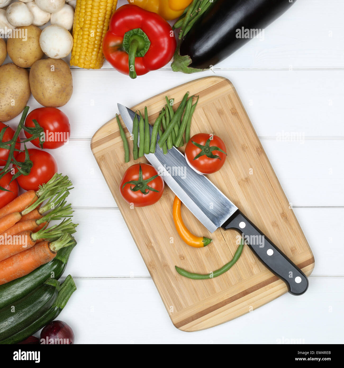 Vegetarian and vegan eating smiling face from vegetables on cutting ...