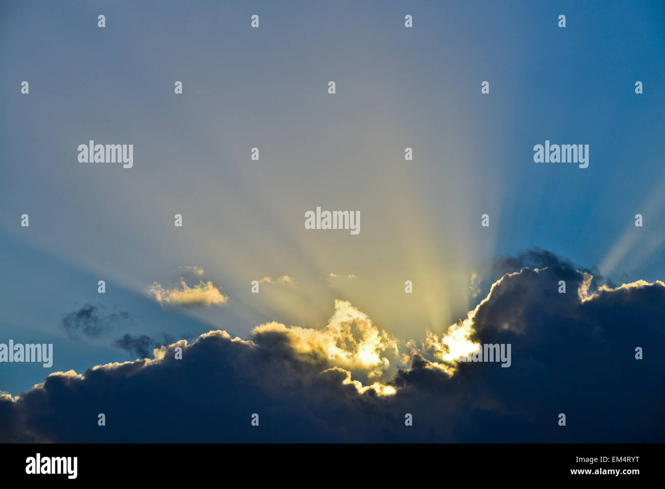 Clouds and sun rays, backlight Stock Photo - Alamy
