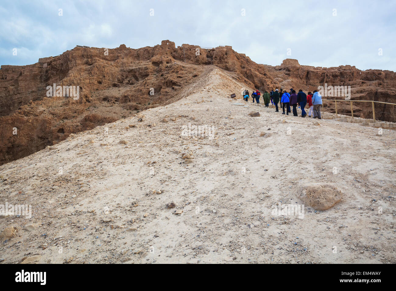A Group Of People Walking Up A Path At The Ancient Fortification Masada ...