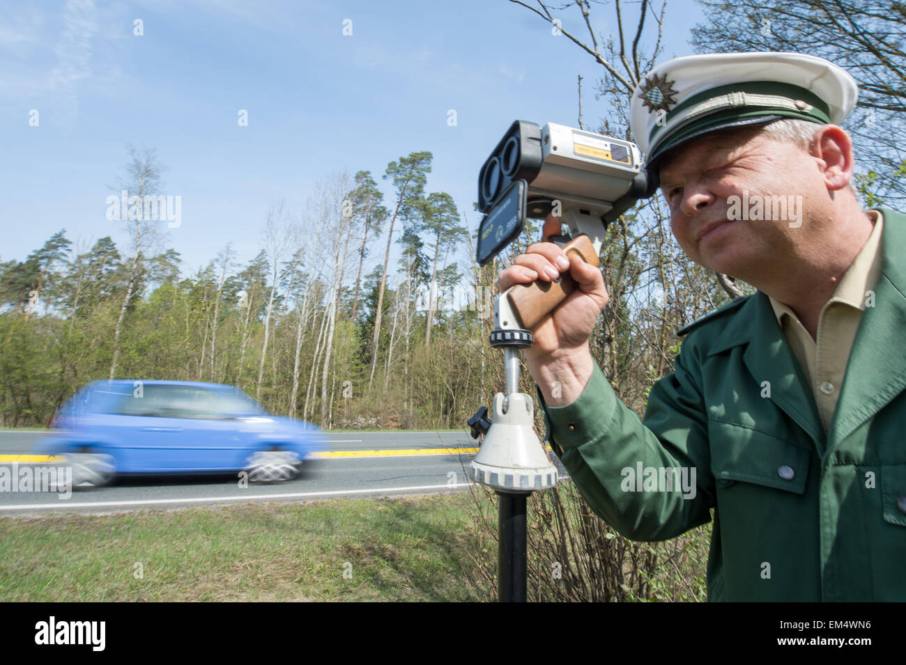 Nuremberg, Germany. 16th Apr, 2015. A police officer measures the speed ...