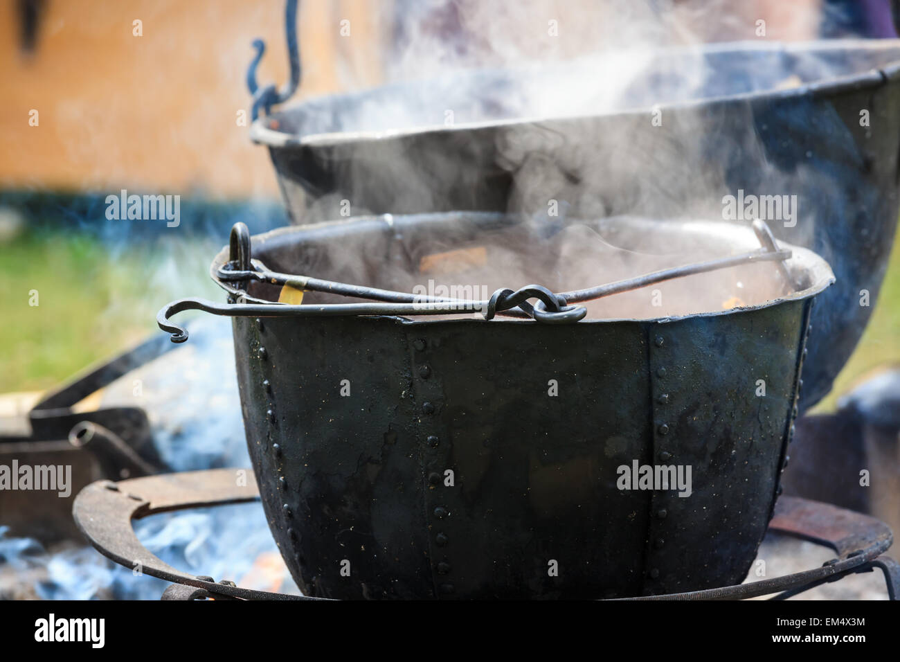 Soup cooking in medieval pot Stock Photo - Alamy