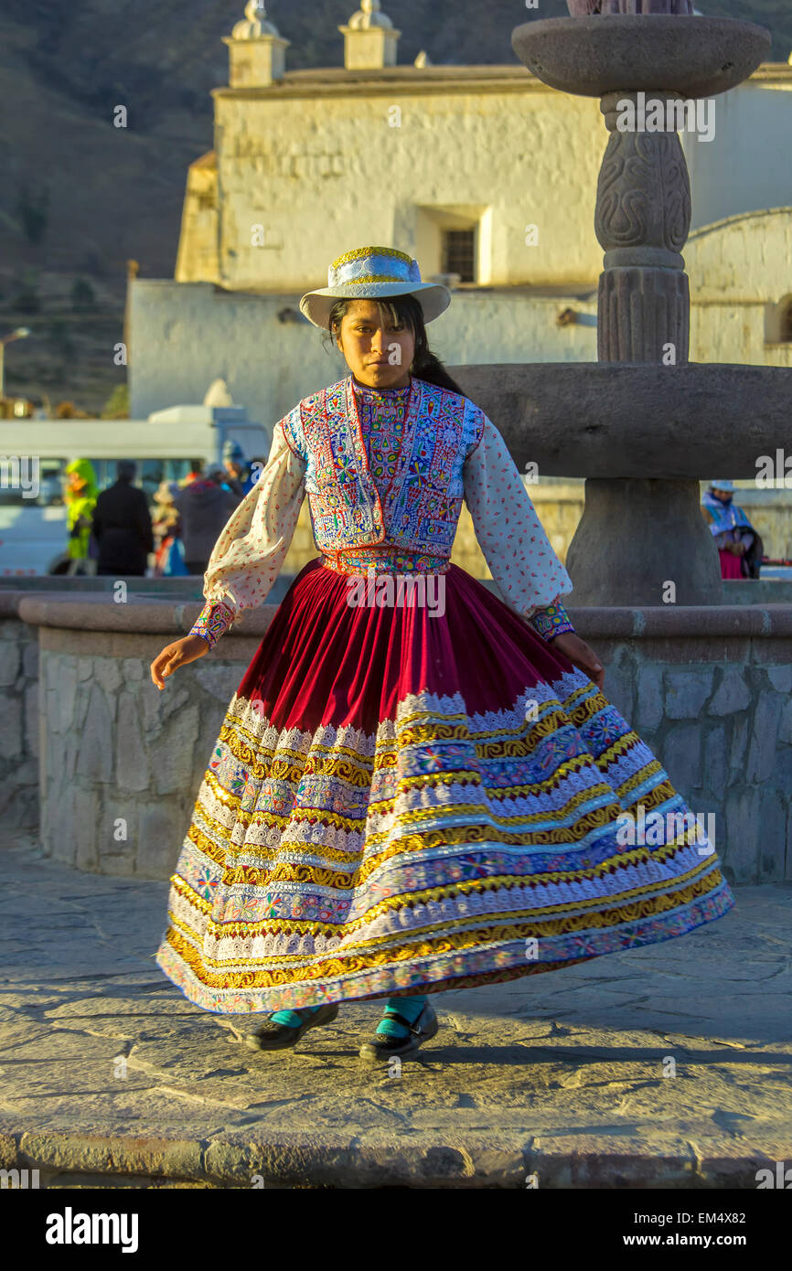 Peruvian girl in traditional garb, dancing in the morning light Stock ...