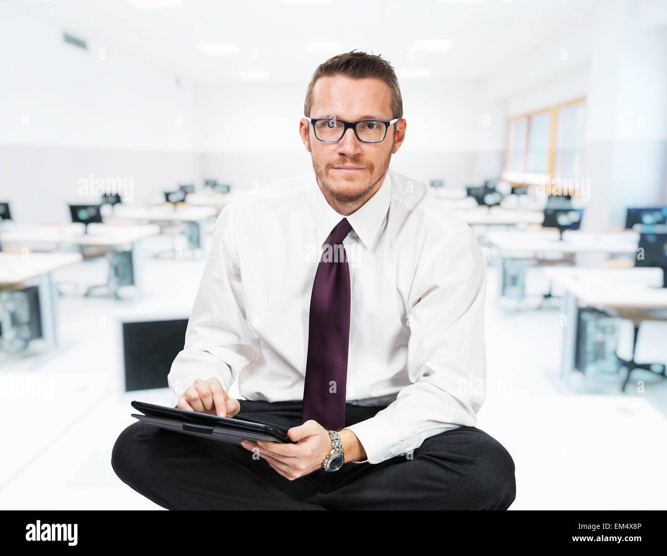 sit businessman with tablet and school background Stock Photo - Alamy