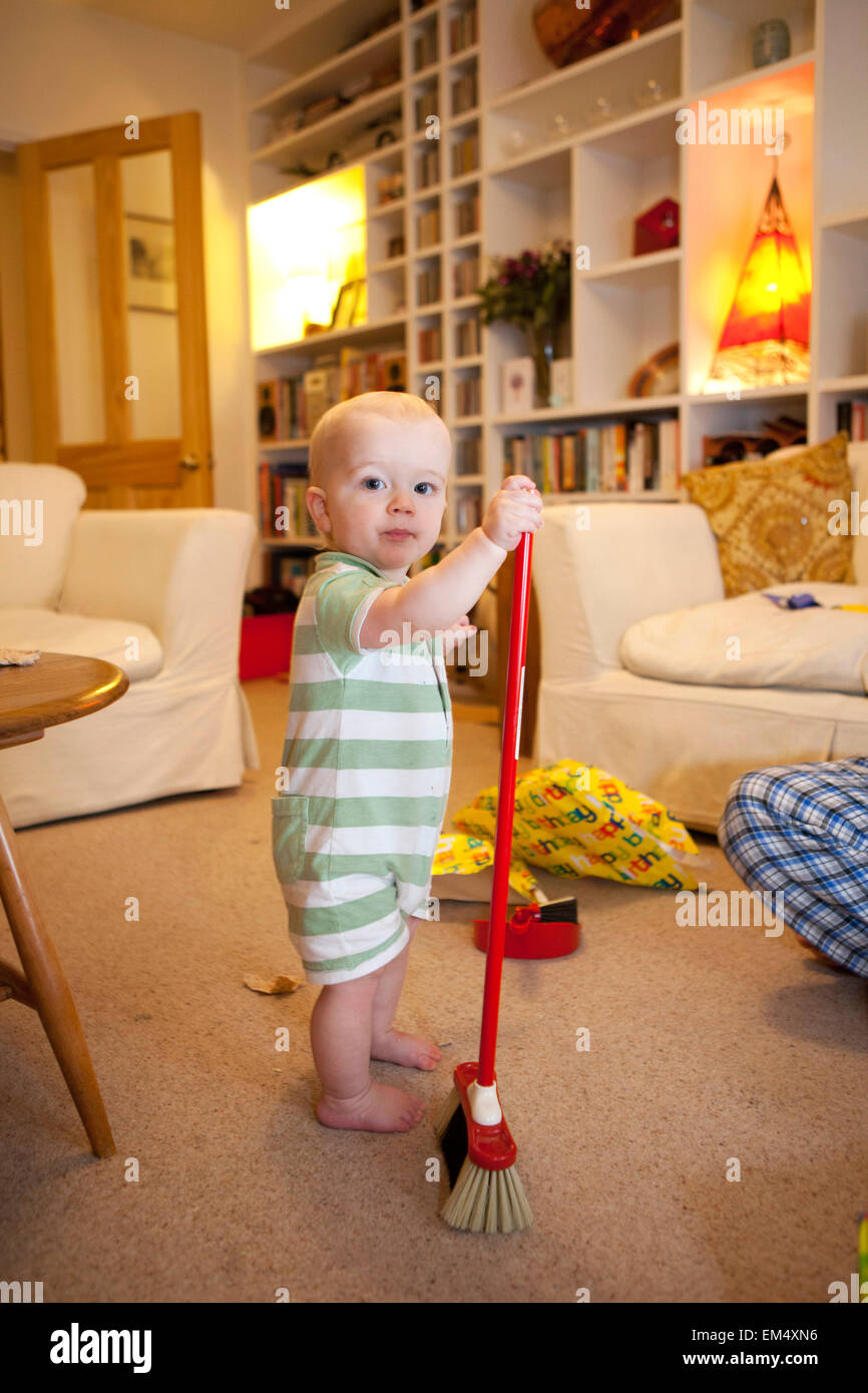 Child playing broom hi-res stock photography and images - Alamy