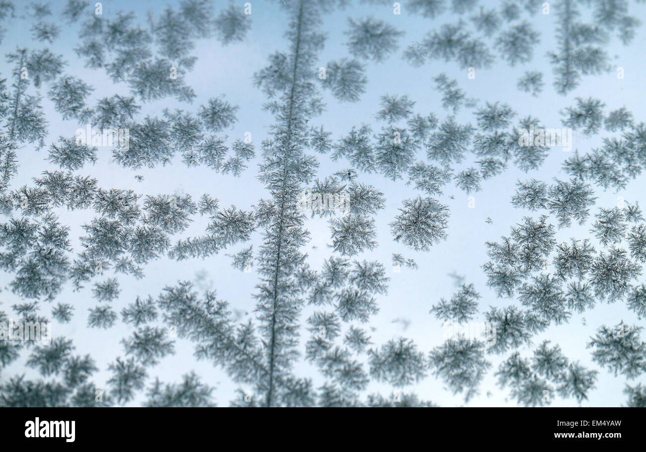 Snowflakes frozen glass windows is photographed close up Stock Photo ...