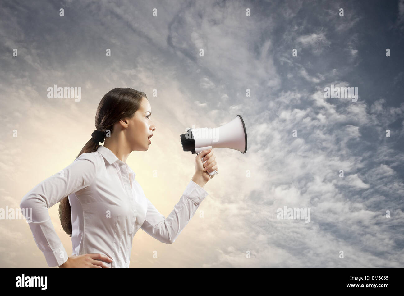 Angry female screaming in megaphone hi-res stock photography and images ...