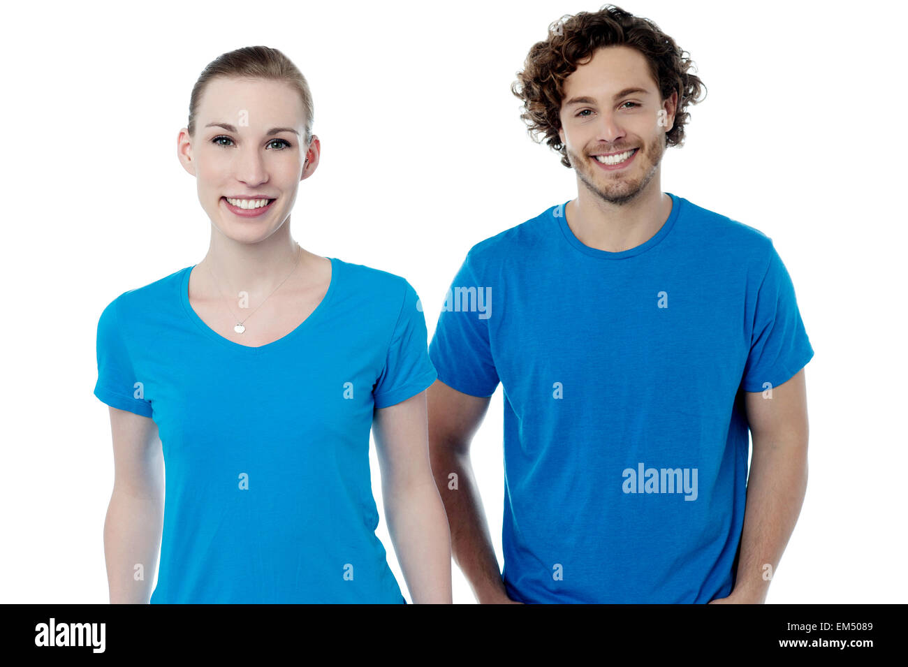 Couple in blue t-shirts. Isolated over white Stock Photo - Alamy