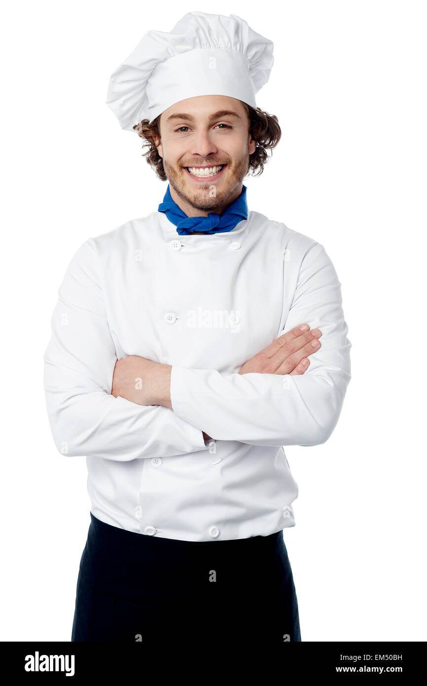Confident young cook posing in uniform Stock Photo - Alamy