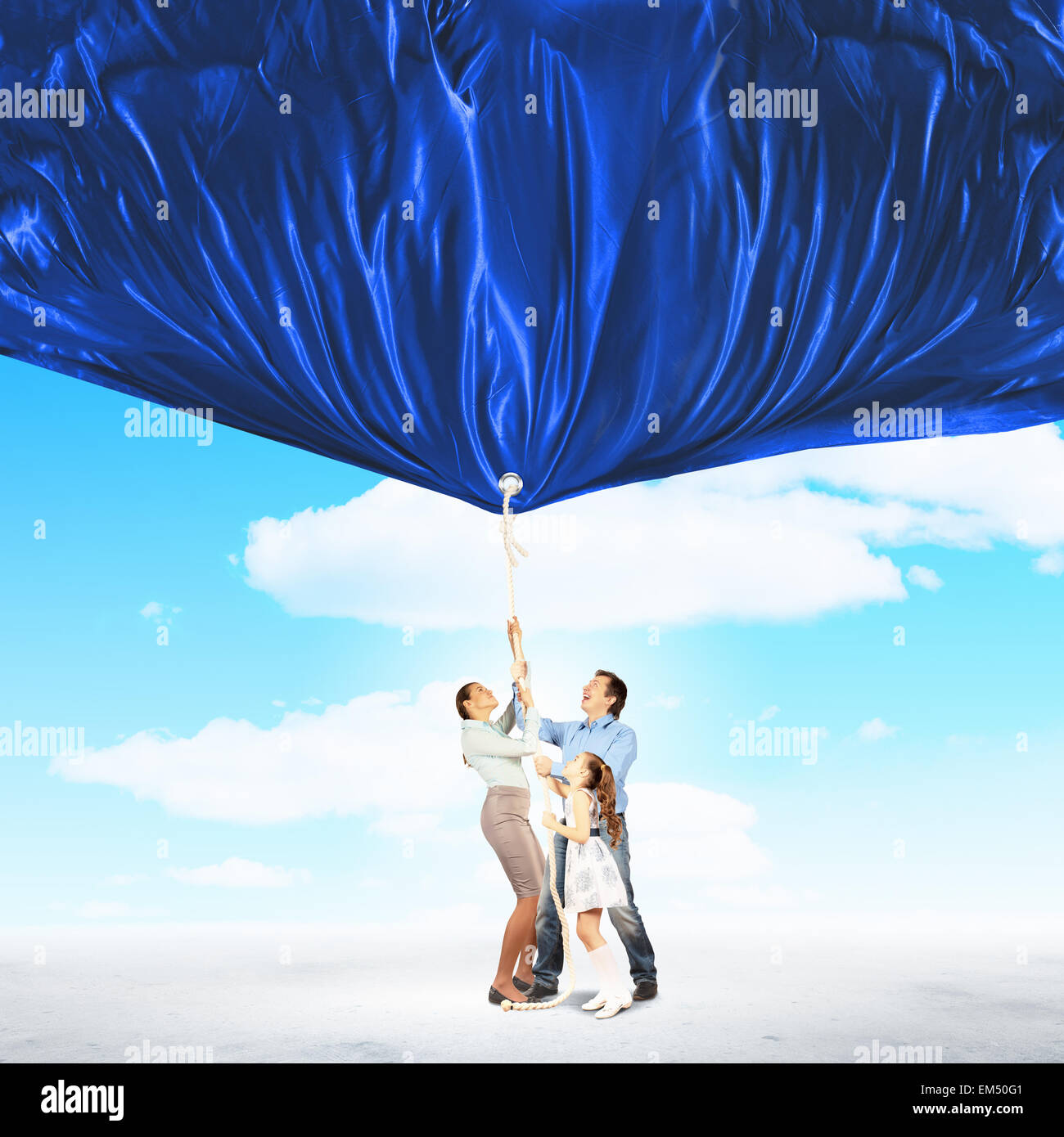 Family pulling banner Stock Photo - Alamy